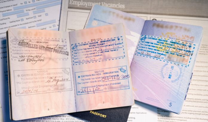 Clampdown on work permit fraud under way - Cayman Compass
