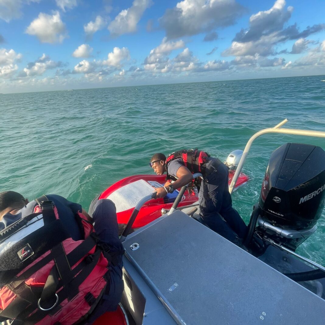 Coast Guard rescues three from sinking boat in North Sound - Cayman Compass